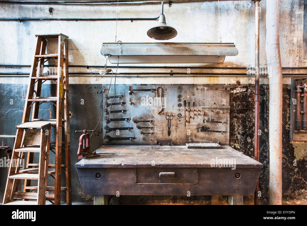 Work bench in rusty factory shop Stock Photo - Alamy