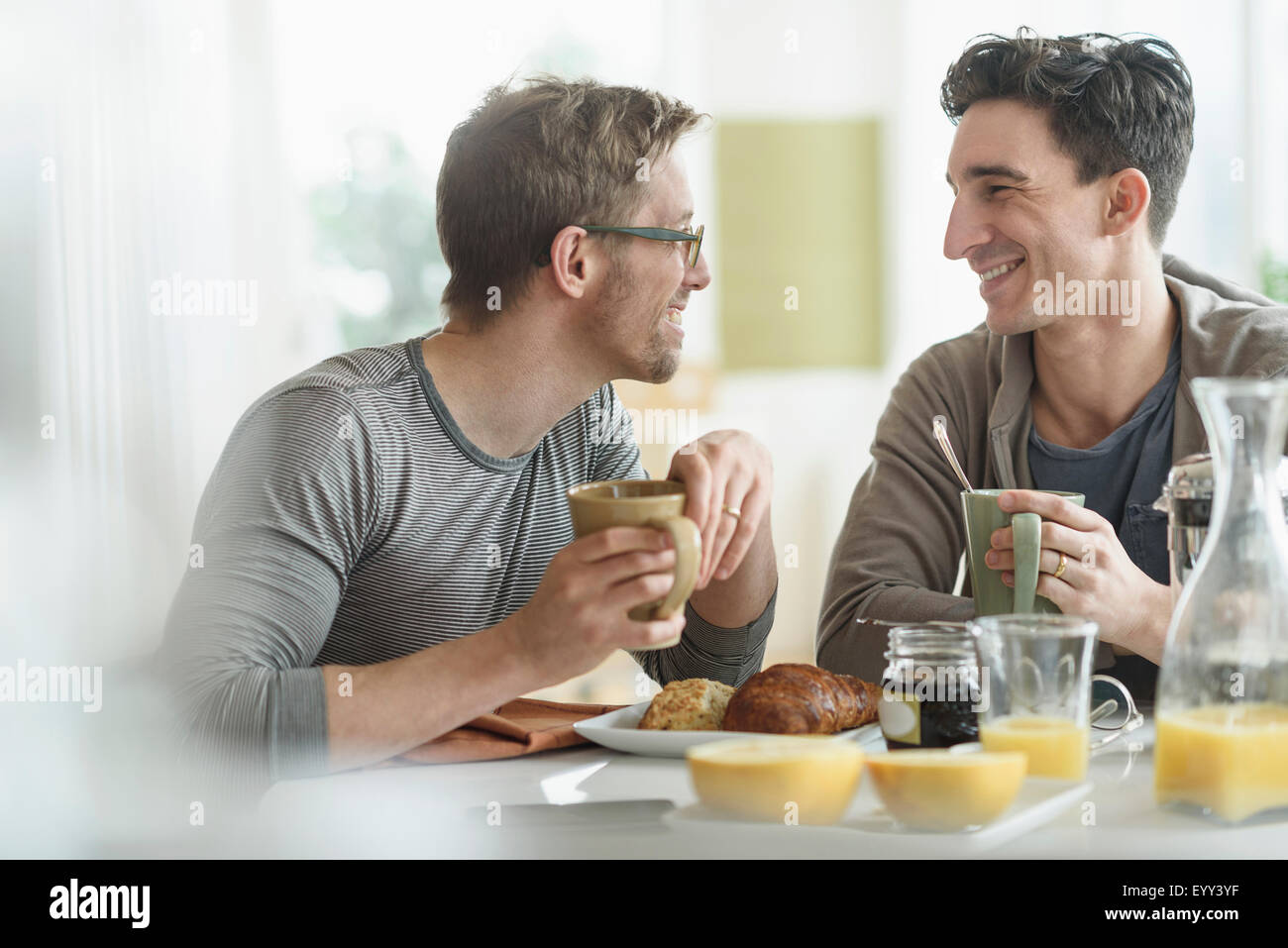 Caucasian gay couple eating breakfast together Stock Photo - Alamy