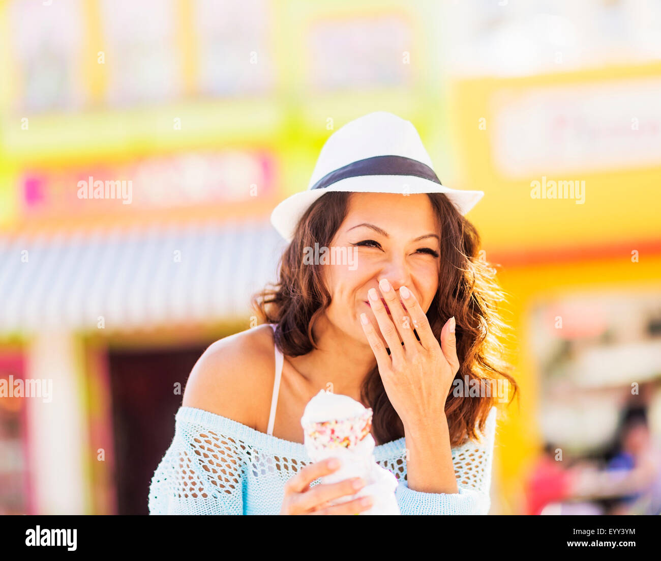 Chinese woman eating ice cream cone Stock Photo - Alamy