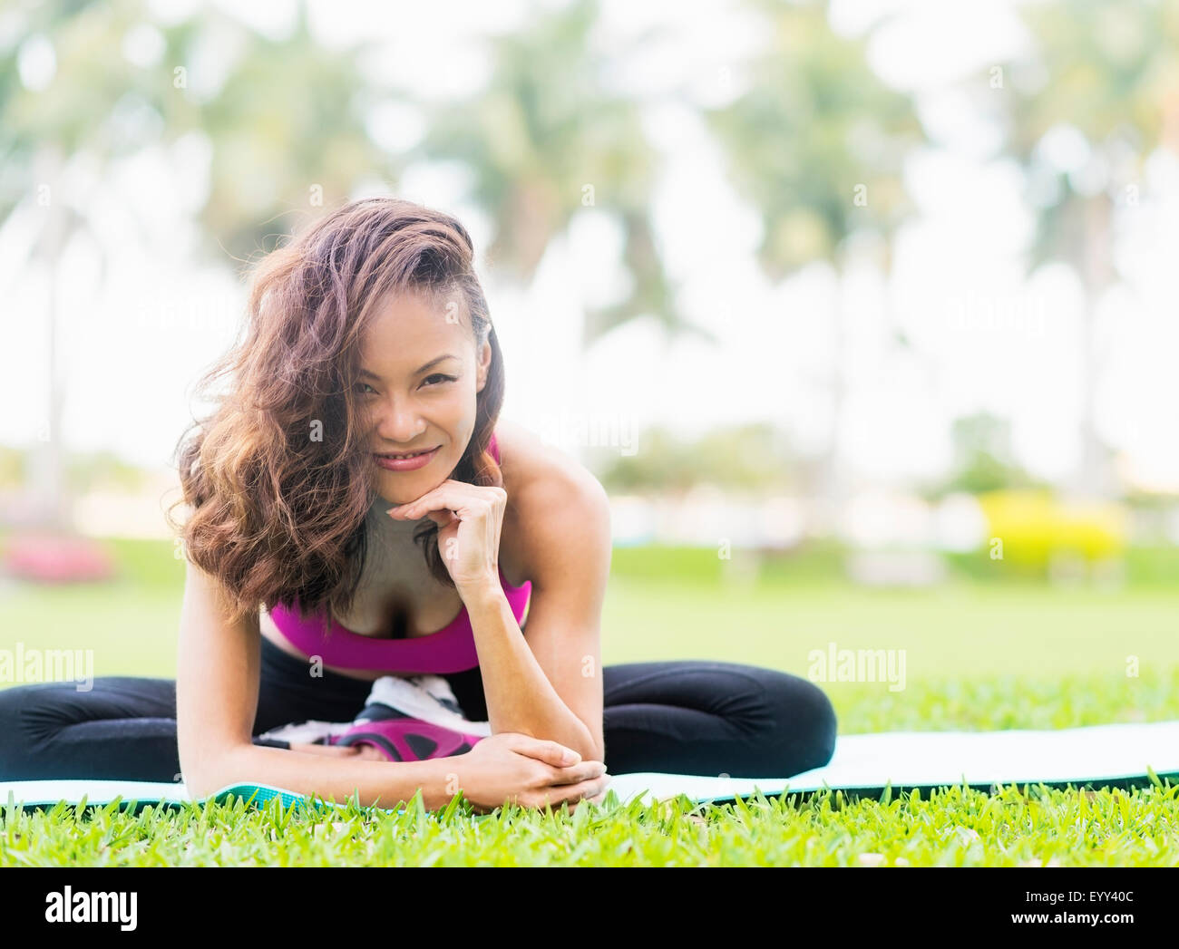 Chinese woman stretching in park Stock Photo - Alamy