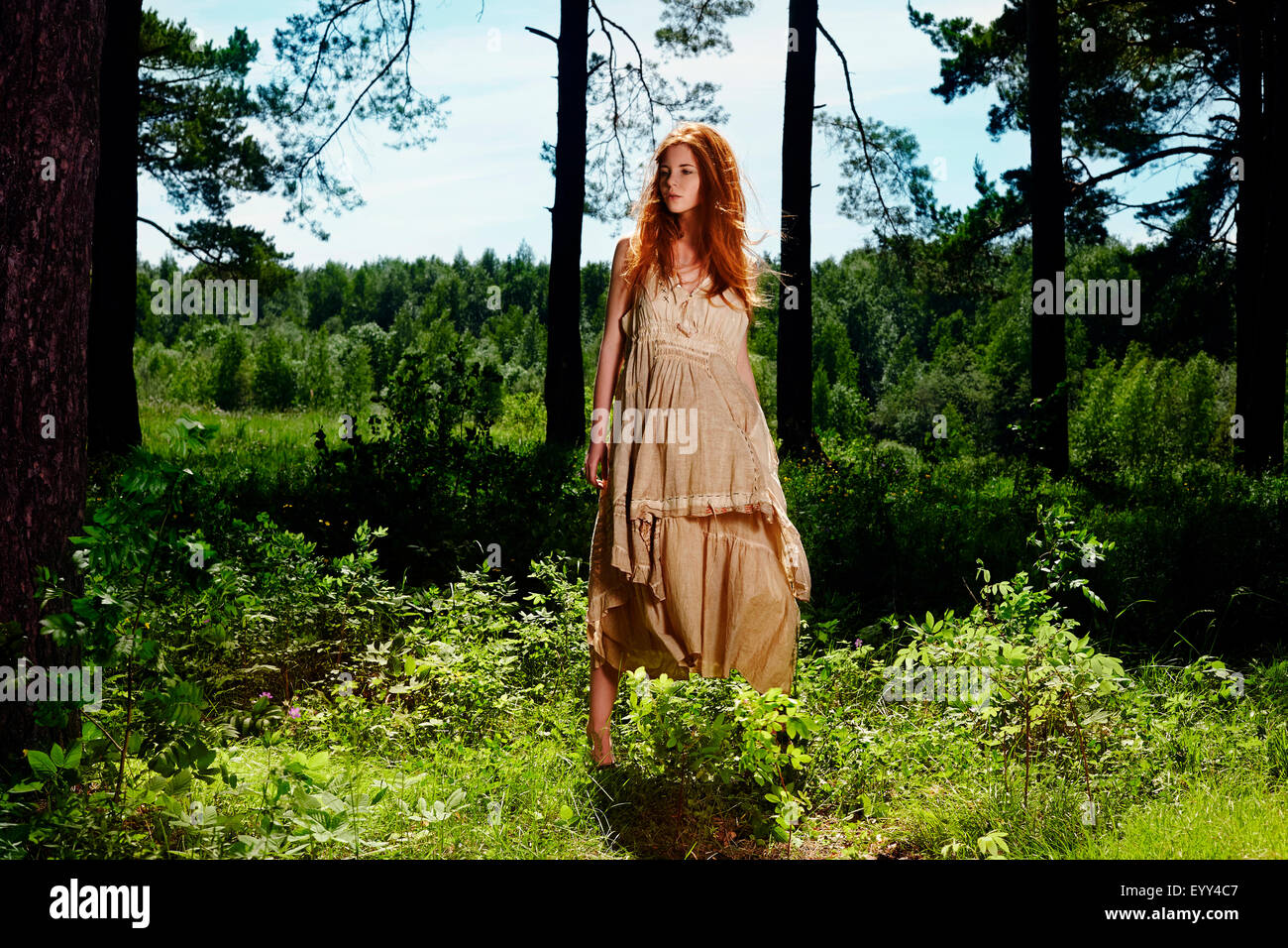 Caucasian woman standing in forest Stock Photo - Alamy