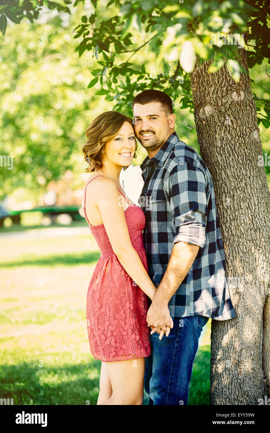 Couple underneath tree hi-res stock photography and images - Alamy