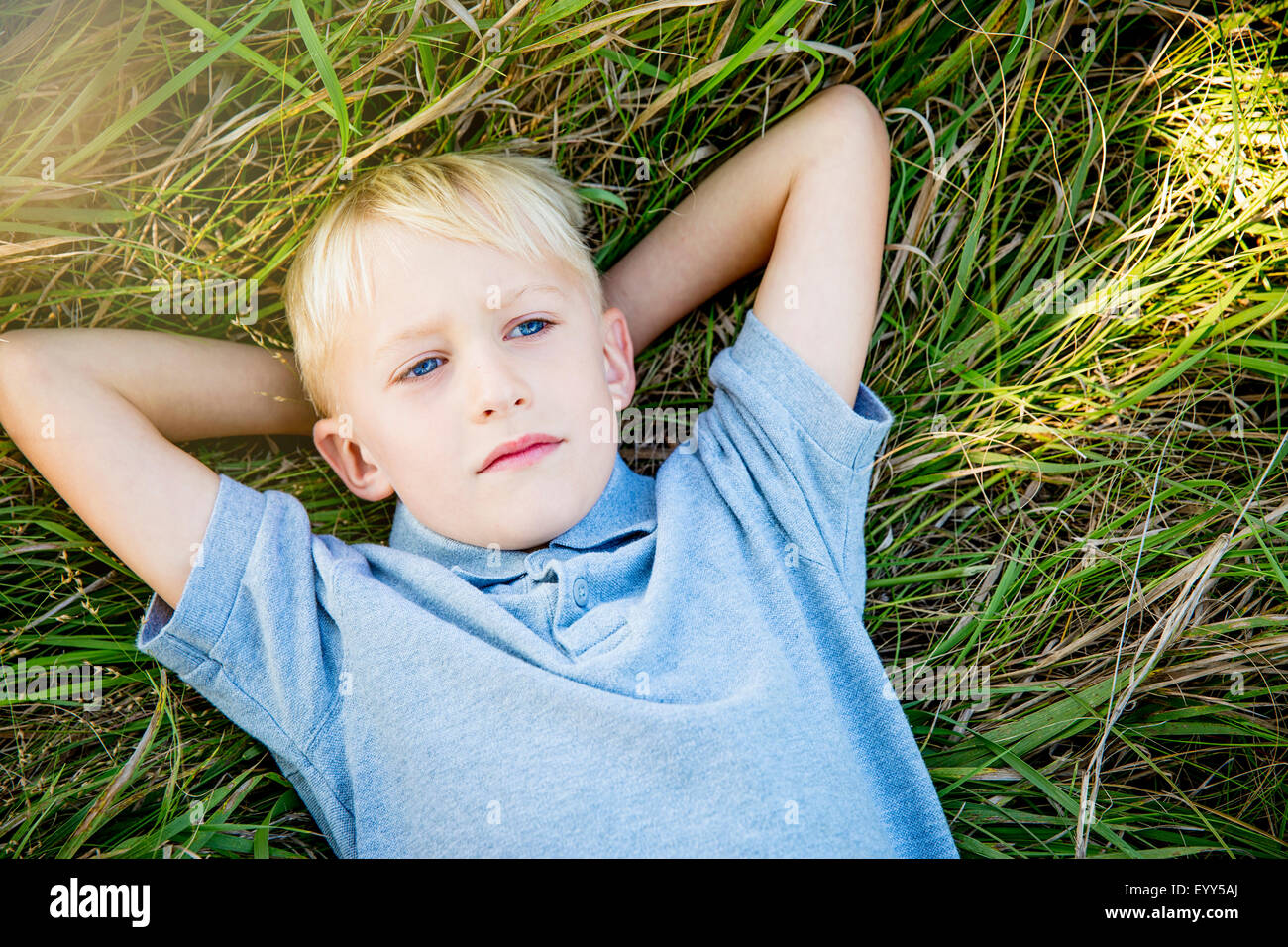 One boy laying in hi-res stock photography and images - Alamy