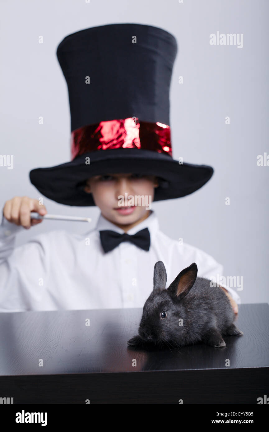 little magician with rabbit studio shot Stock Photo - Alamy