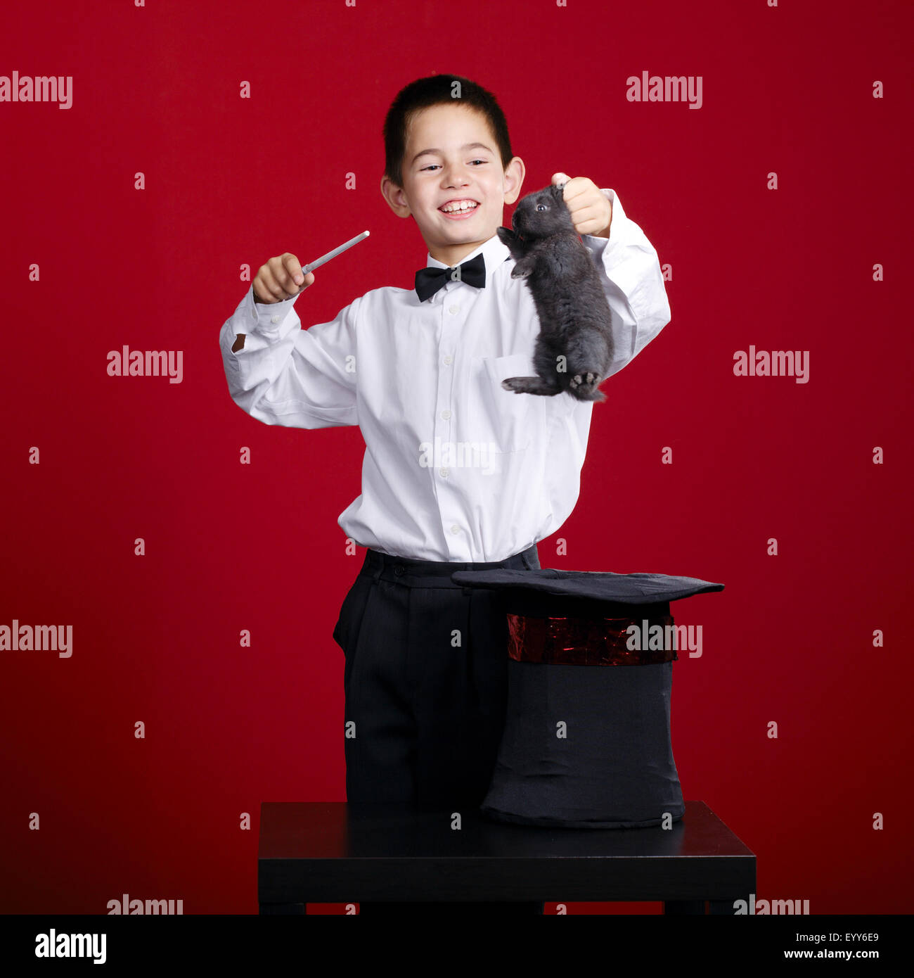 little magician with rabbit Stock Photo - Alamy