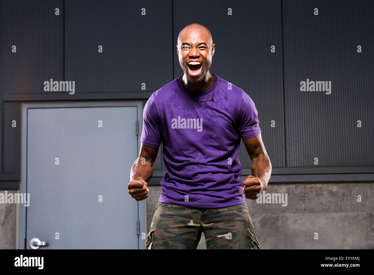 Black man cheering Stock Photo - Alamy