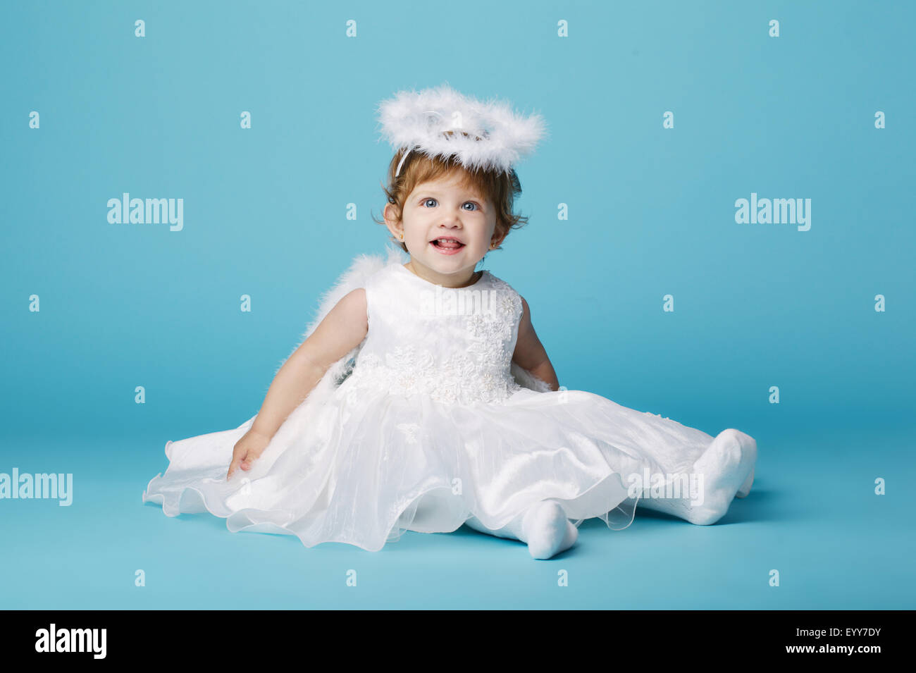 little angel on blue background Stock Photo - Alamy