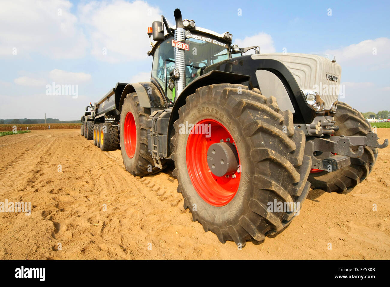 Tractor with container on a field hi-res stock photography and images ...