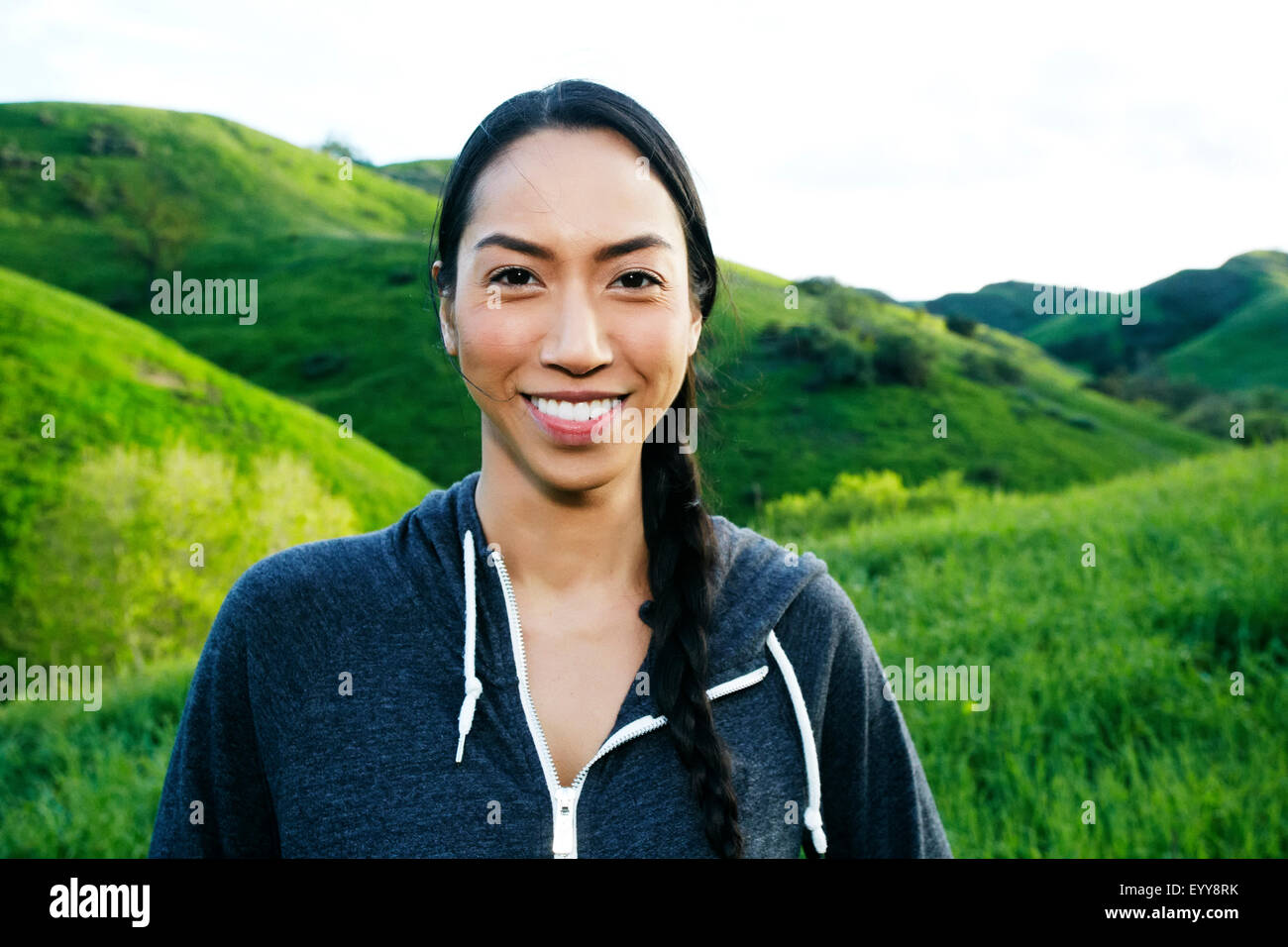Mixed race athlete standing on rural hillside Stock Photo - Alamy