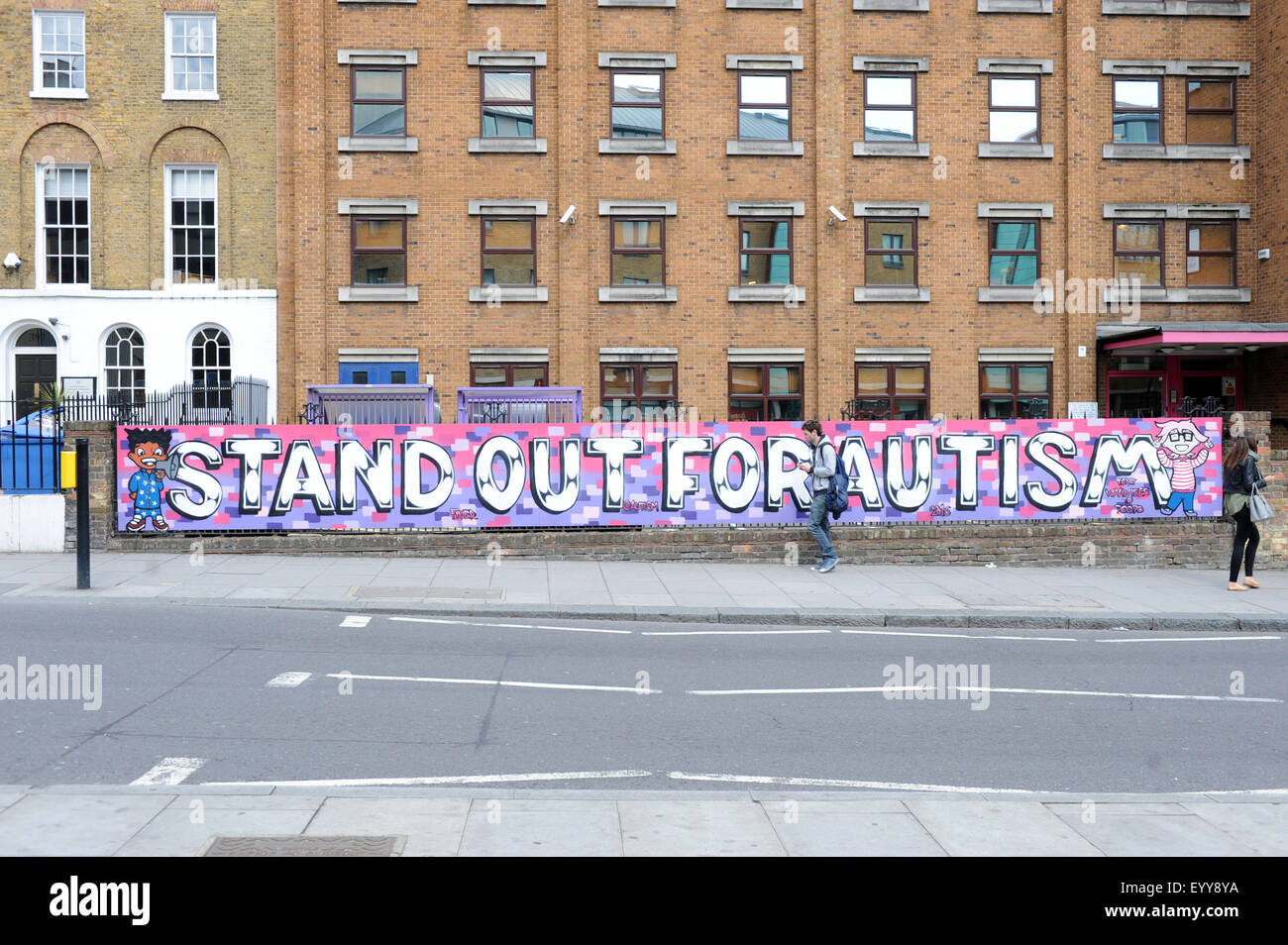 Graffiti on boards outside the head offices of charity The National ...