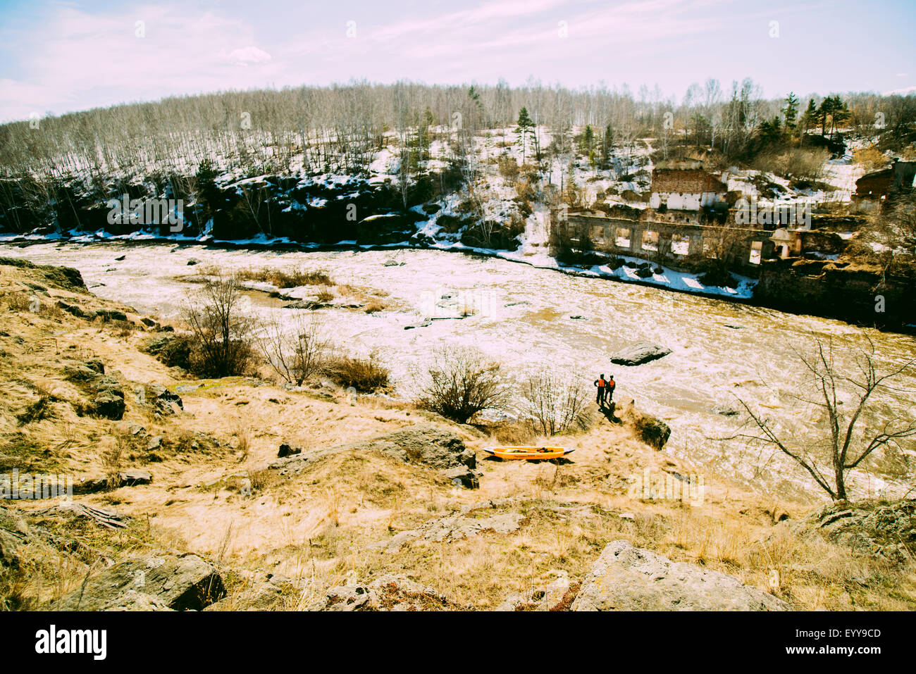 Caucasian men standing near remote river Stock Photo - Alamy