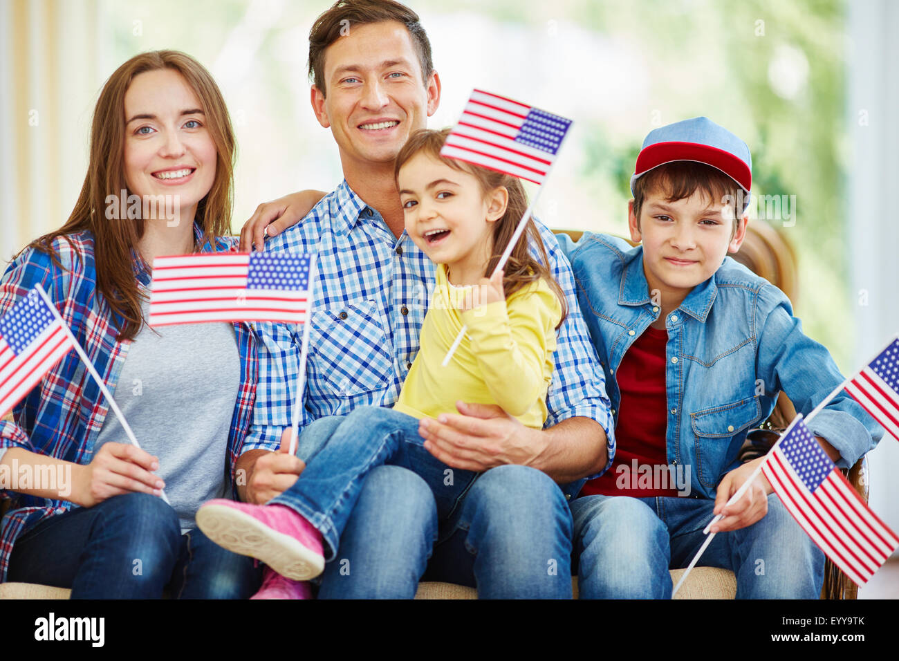 Modern American family with flags celebrating Independence Day Stock ...