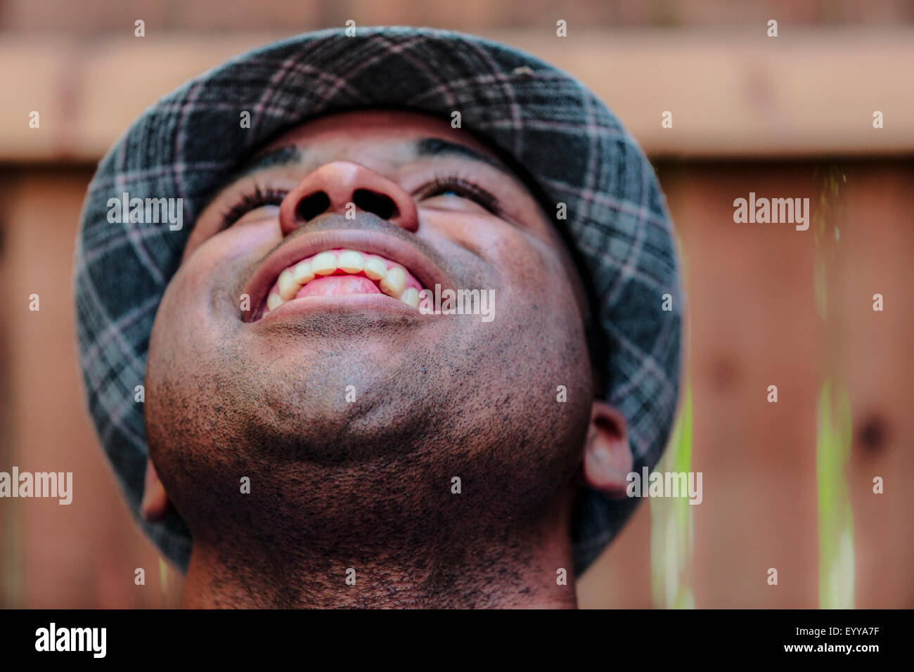 Close up of smiling Black man looking up Stock Photo - Alamy
