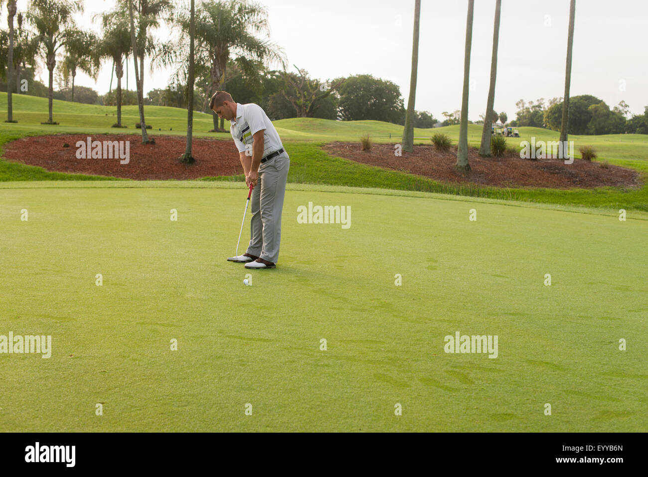 Young man outdoors putting hi-res stock photography and images - Alamy
