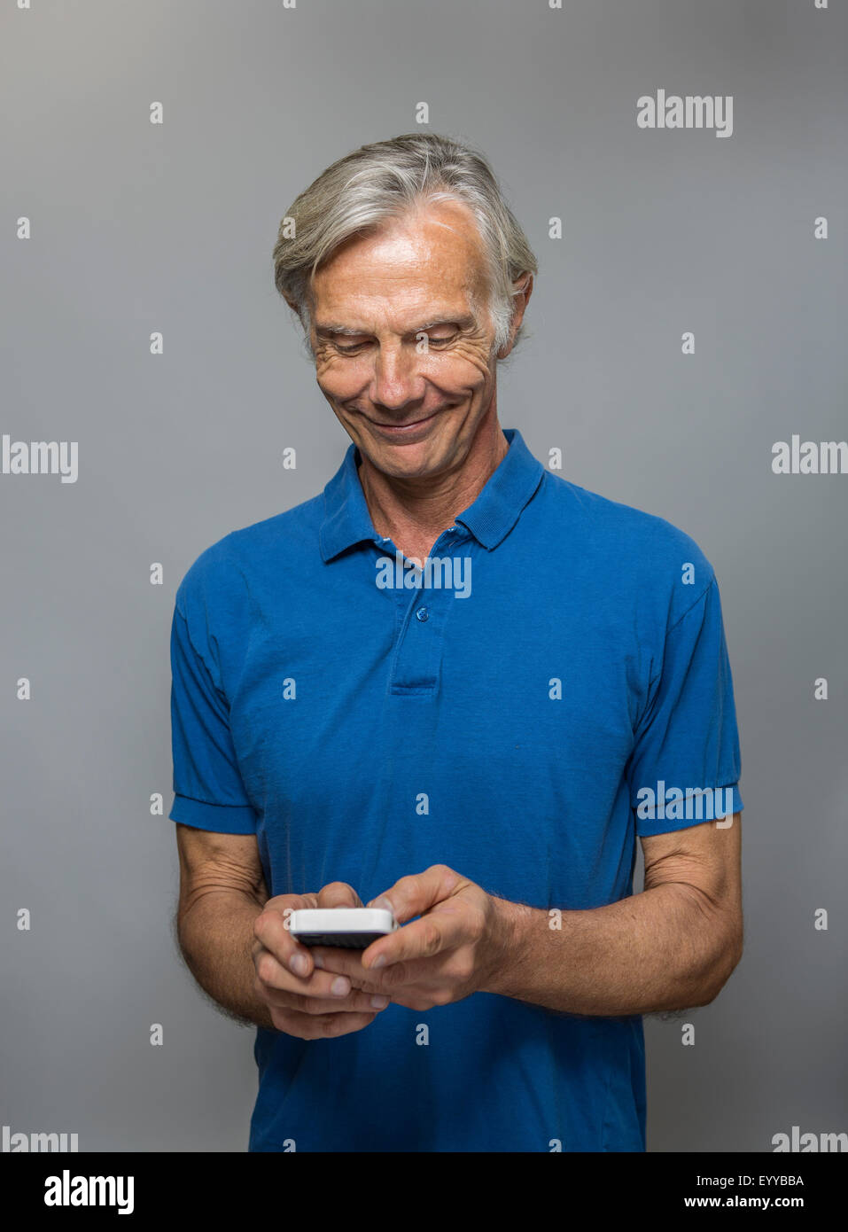 Older Caucasian man using cell phone Stock Photo - Alamy