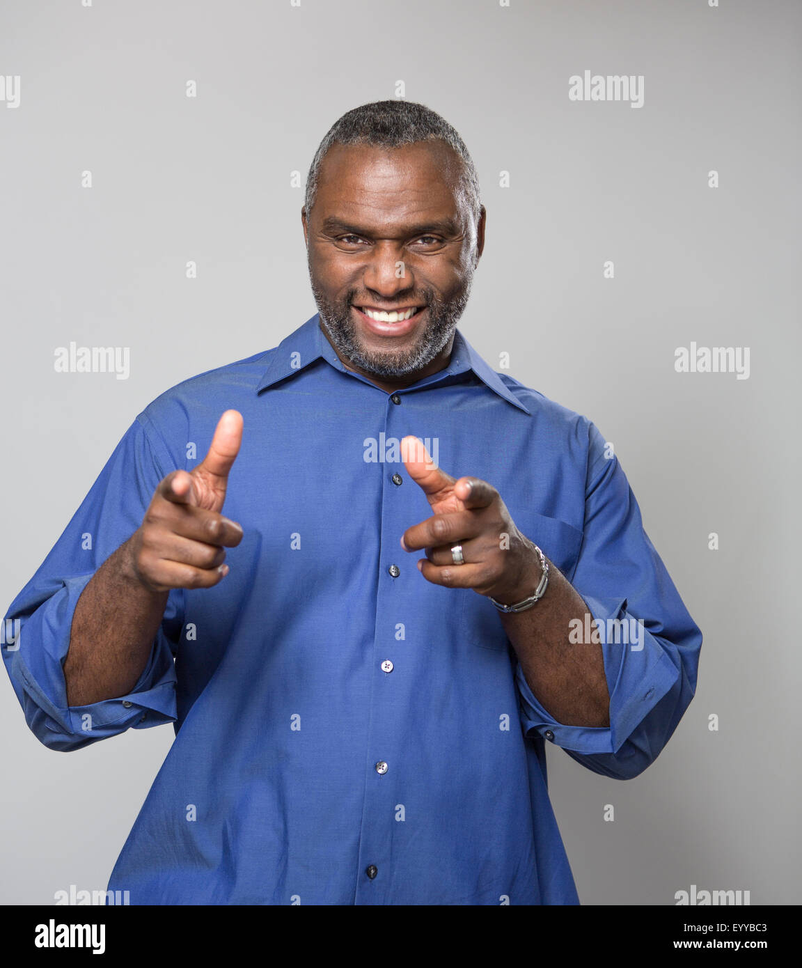 Smiling older African American man pointing Stock Photo - Alamy