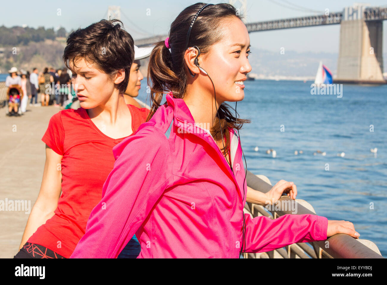 Runner stretching at waterfront, San Francisco, California, United ...