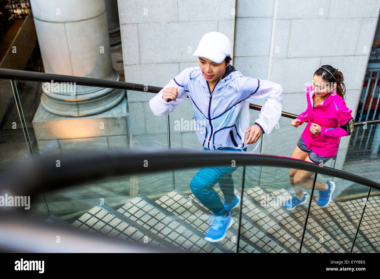 High angle view of women running on staircase Stock Photo - Alamy