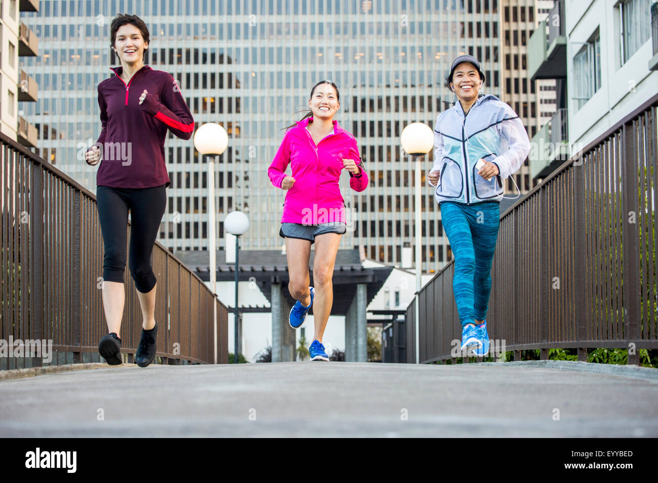 Women running in city Stock Photo - Alamy