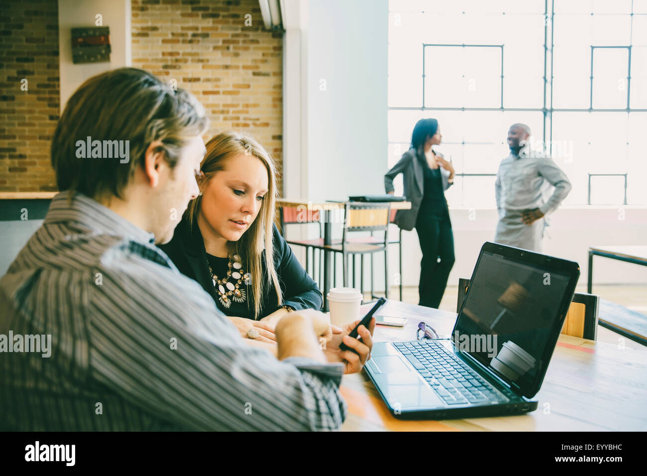 Business people talking in cafe hi-res stock photography and images - Alamy