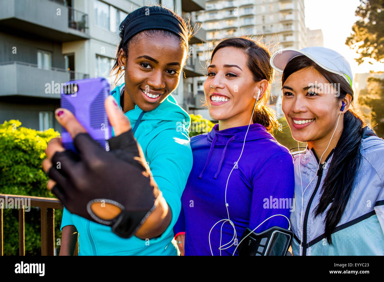 Runners taking selfie on in city Stock Photo - Alamy