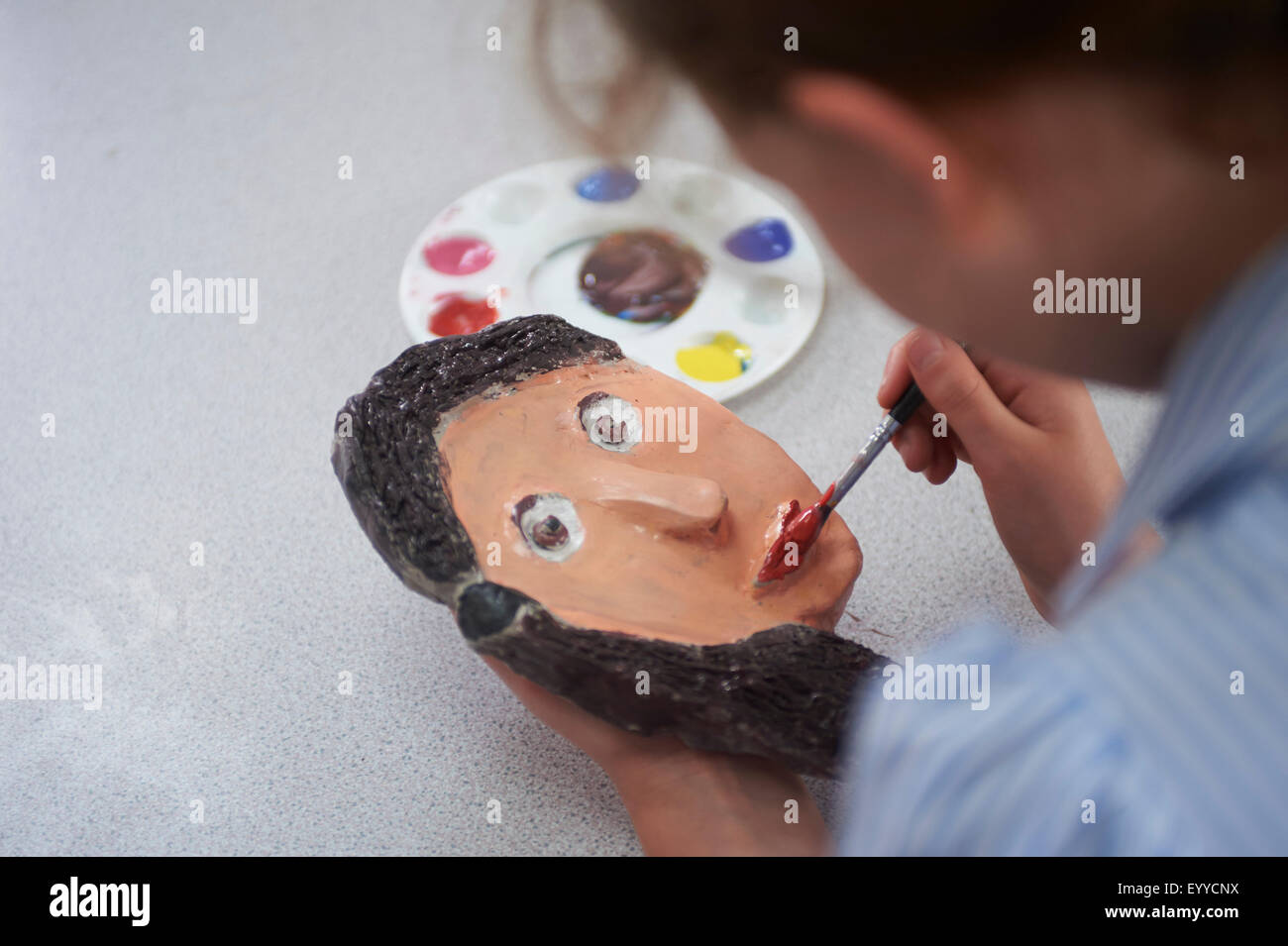 Child hold painting hi-res stock photography and images - Alamy