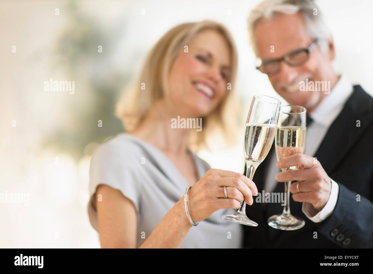 Smiling older Caucasian couple toasting with champagne Stock Photo - Alamy