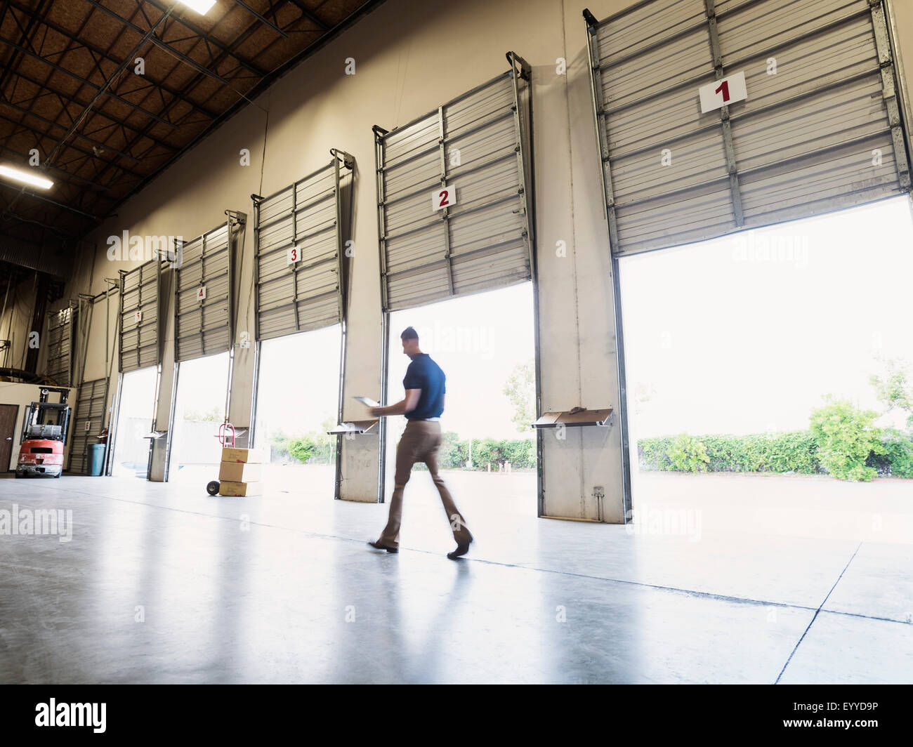 Worker walking hi-res stock photography and images - Alamy