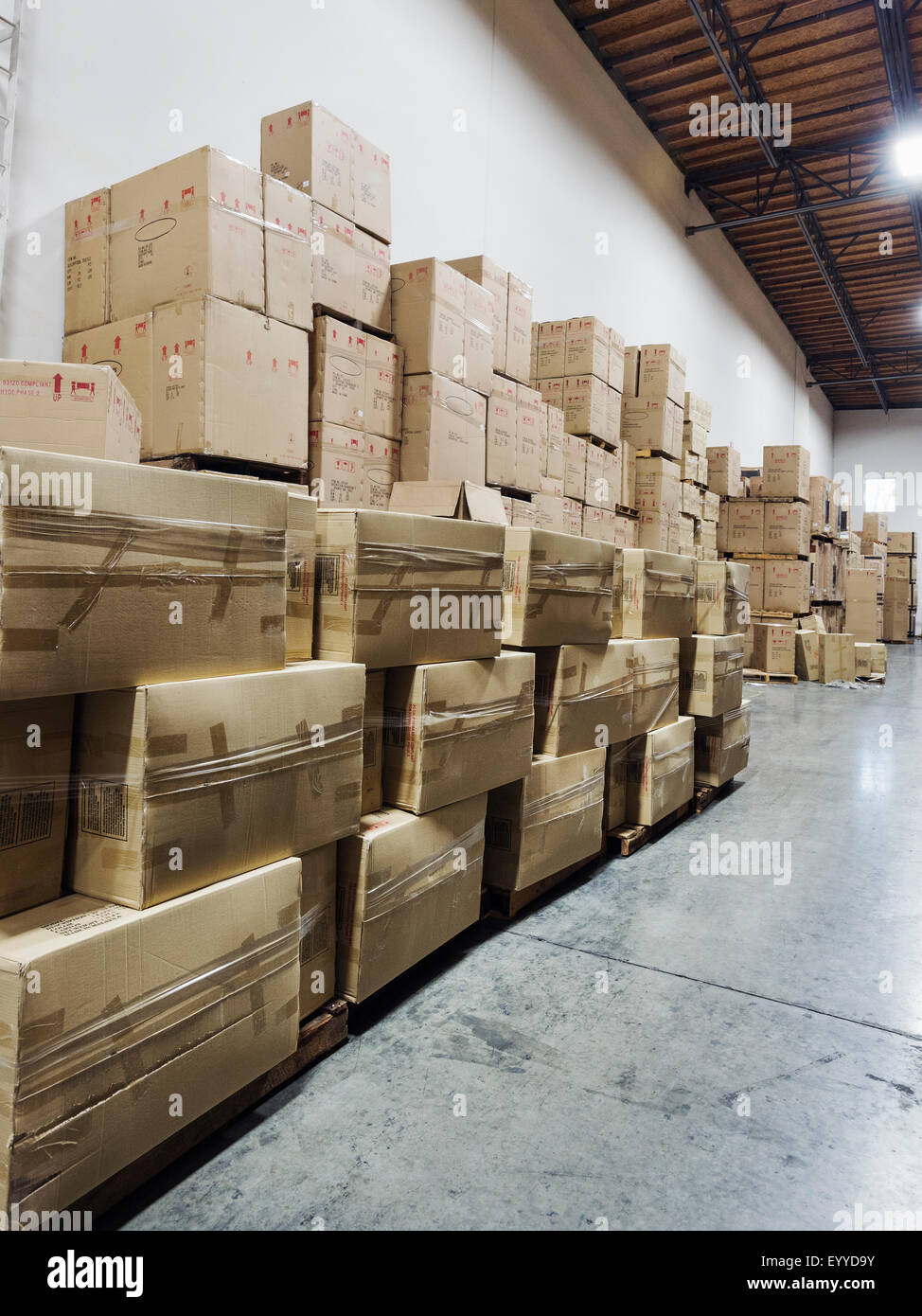 Cardboard boxes in warehouse Stock Photo - Alamy