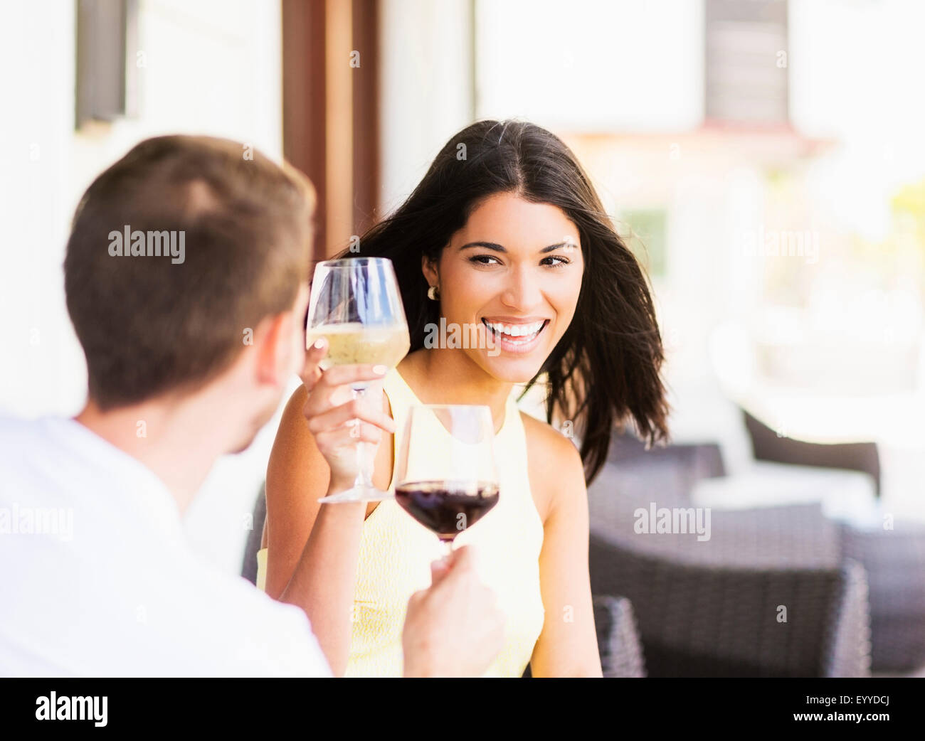 Hispanic couple toasting with wine Stock Photo - Alamy