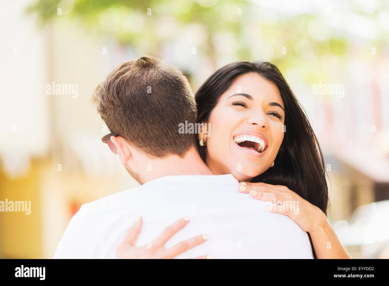 Close up of Hispanic couple hugging outdoors Stock Photo - Alamy