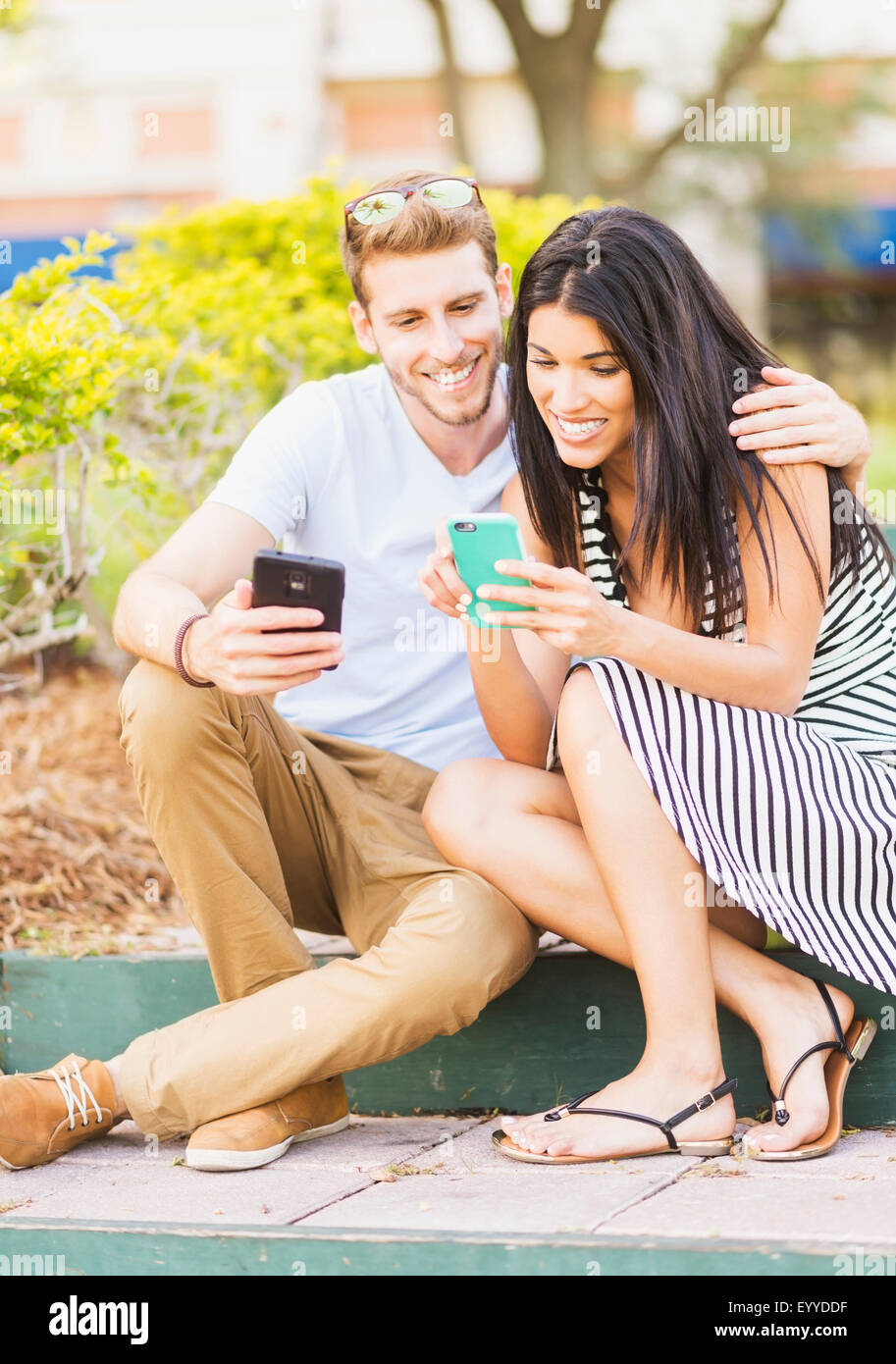 Using two cell phones hi-res stock photography and images - Alamy