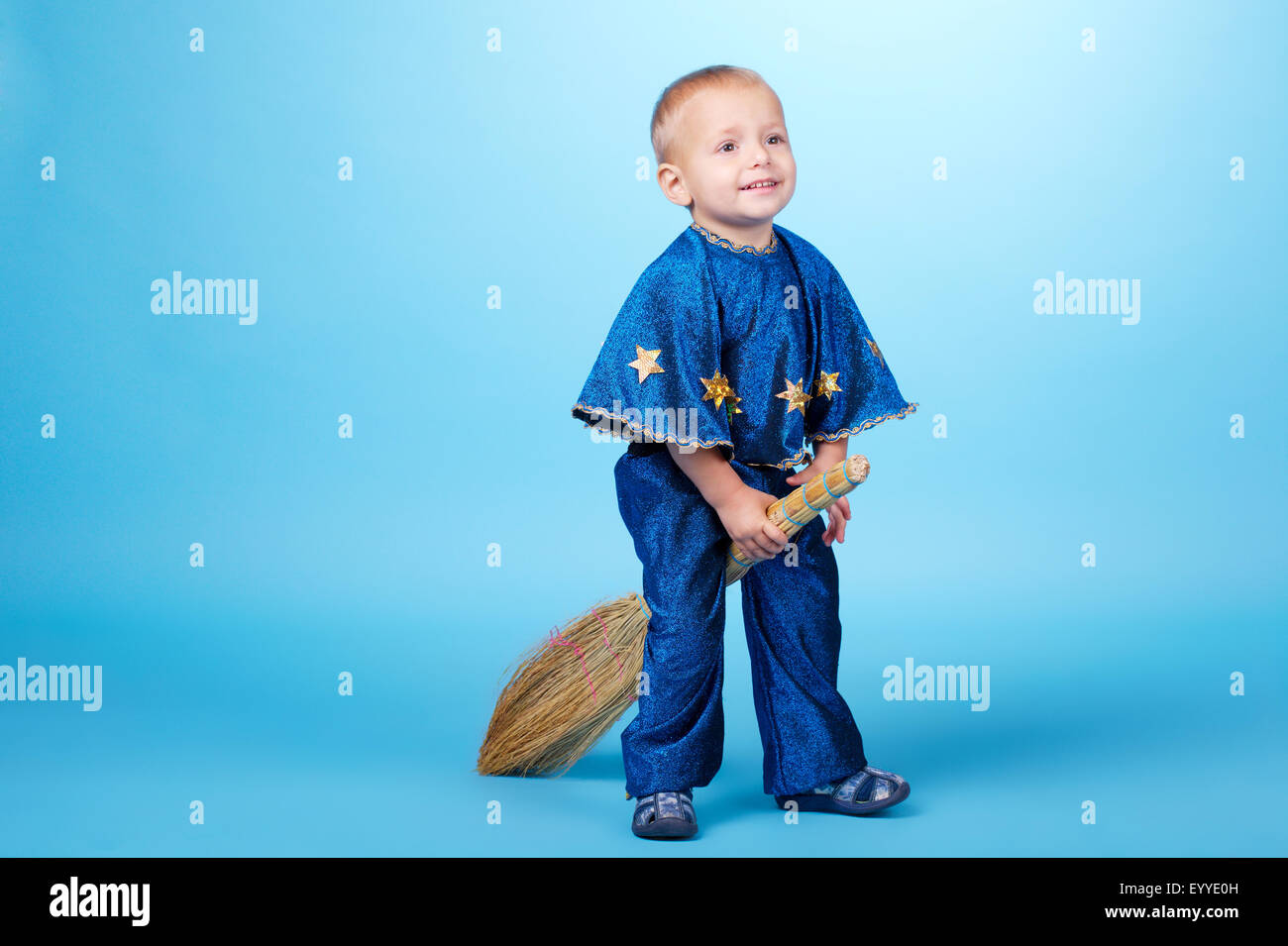 Little boy flying on broom Stock Photo - Alamy