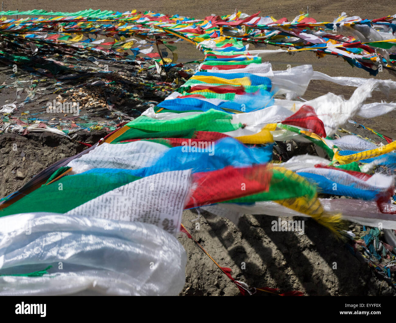 High angle view of prayer flags in wind on remote hillside Stock Photo ...