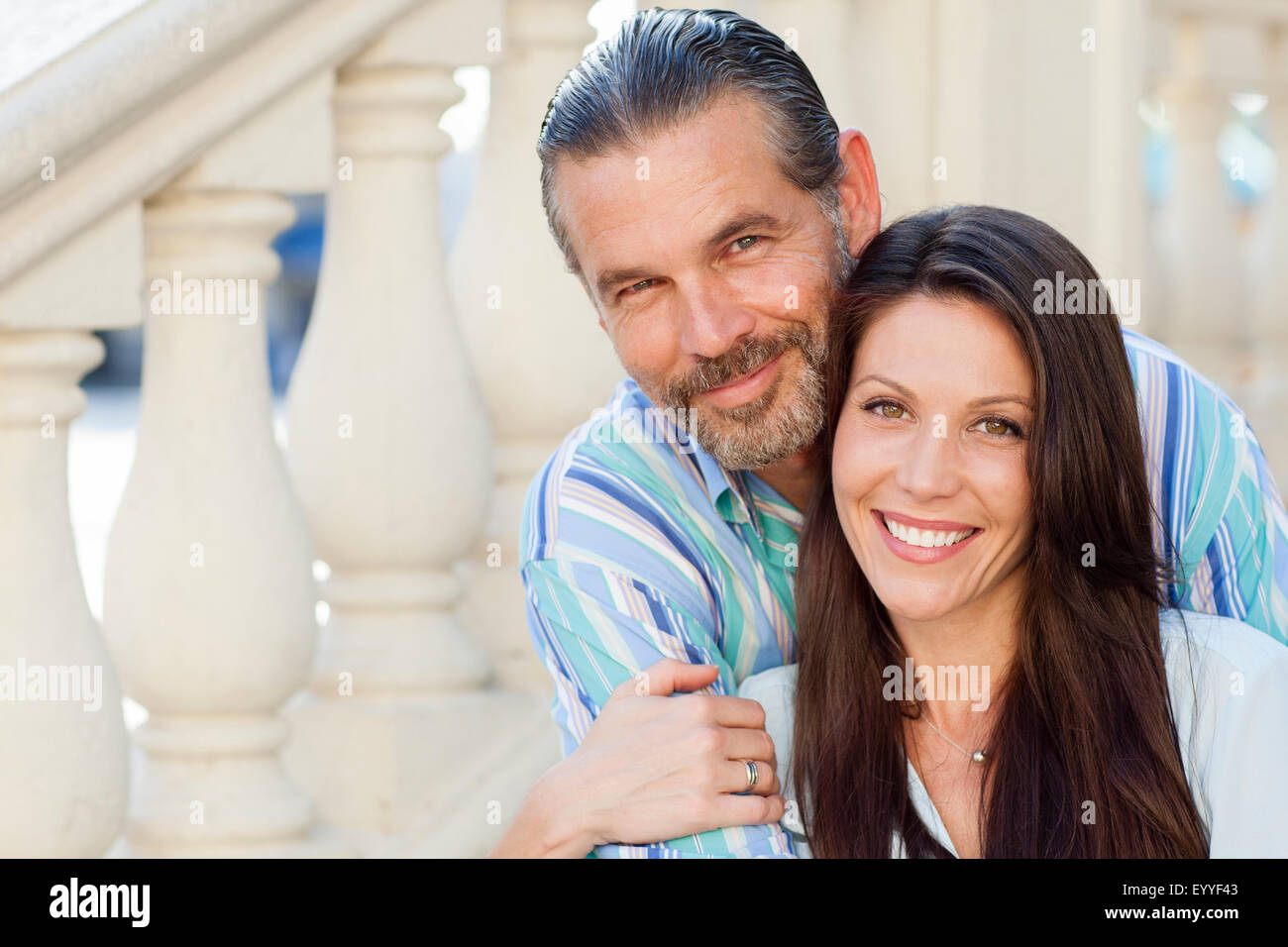 Mature couple hugging sitting on hi-res stock photography and images ...