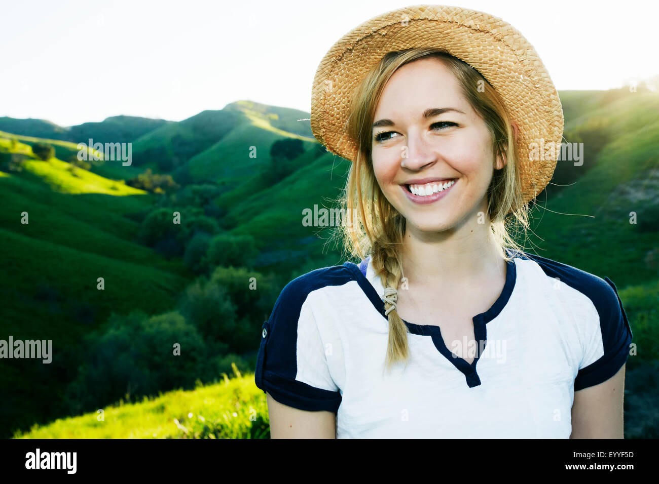 Caucasian woman smiling on rural hilltop Stock Photo - Alamy