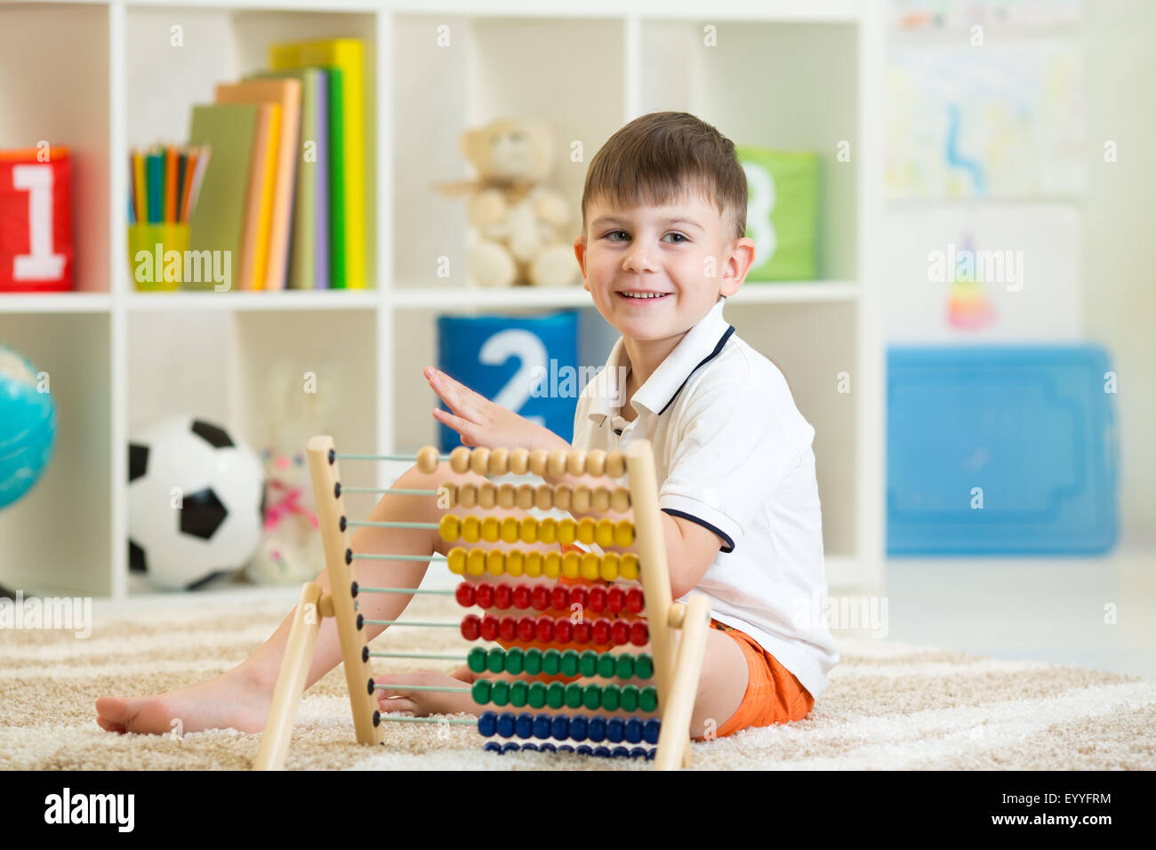 child boy playing with abacus Stock Photo - Alamy