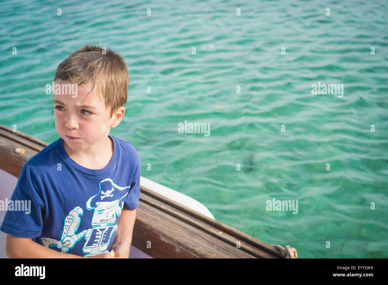 Boys in water with boat hi-res stock photography and images - Alamy
