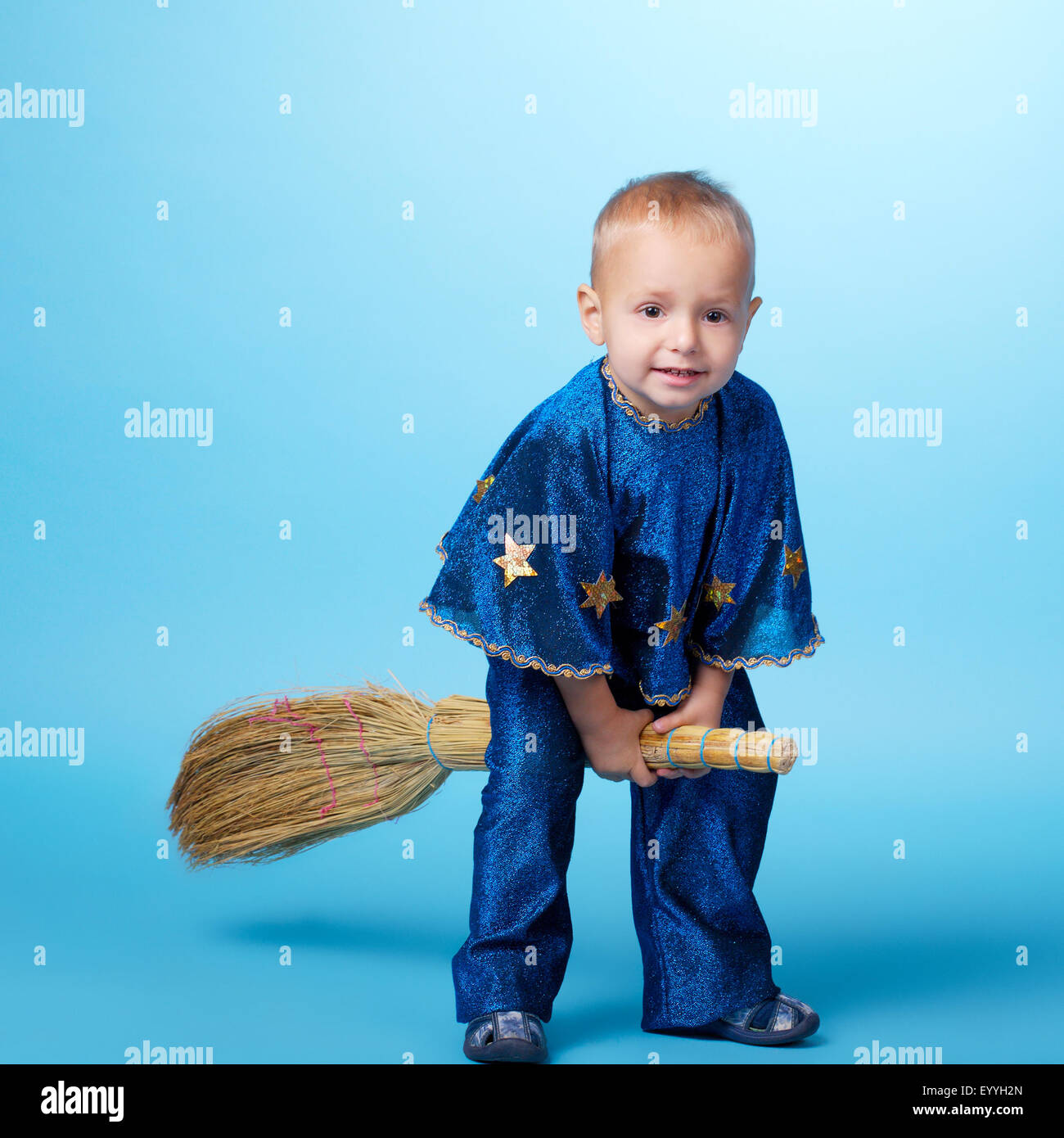 Little boy flying on broom Stock Photo - Alamy
