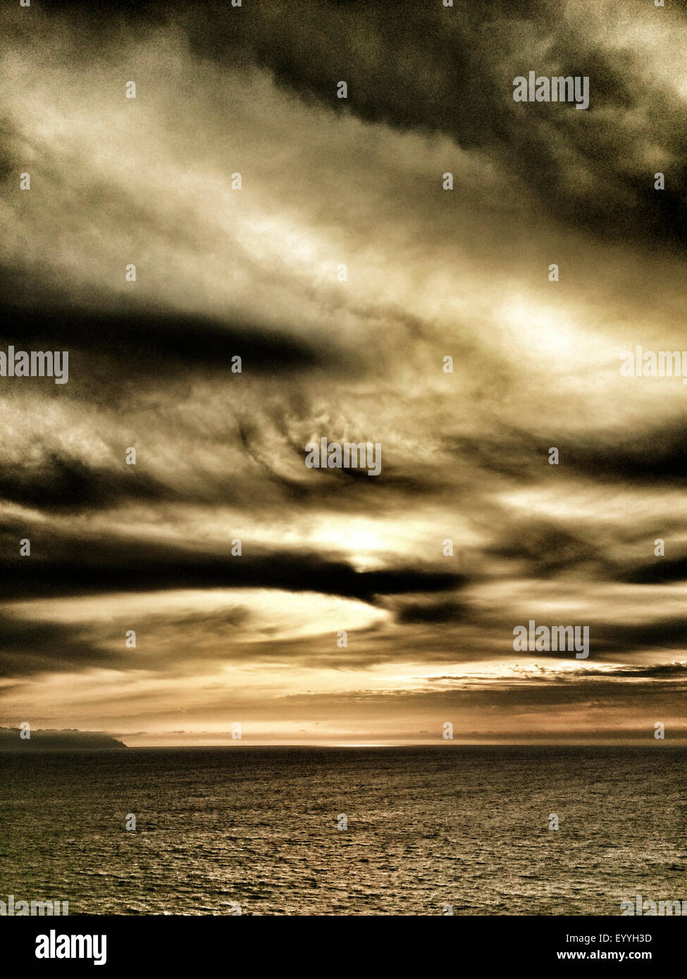 Cloudy skies over the ocean hi-res stock photography and images - Alamy