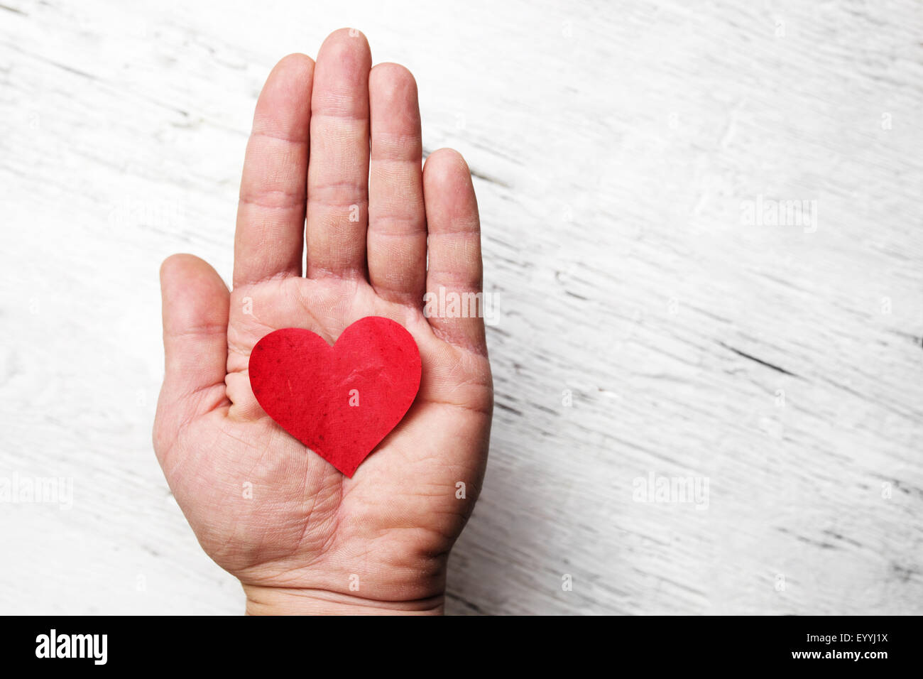 Hand in heart symbol hi-res stock photography and images - Alamy