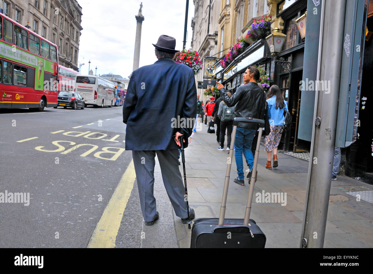 Bus Stop People Standing Stock Photos & Bus Stop People Standing Stock ...