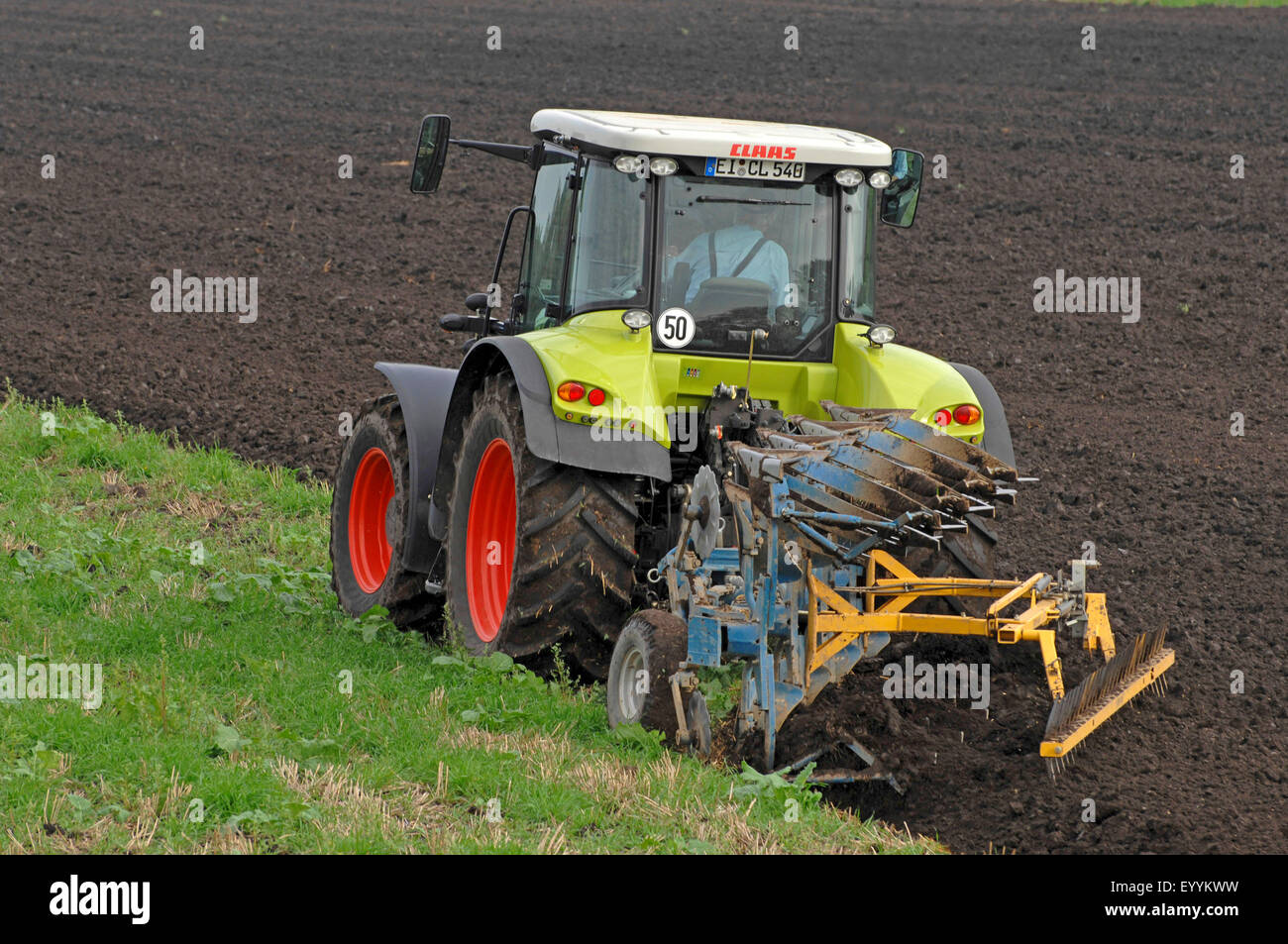 tractor ploughing a field in autumn, Germany, Bavaria Stock Photo - Alamy