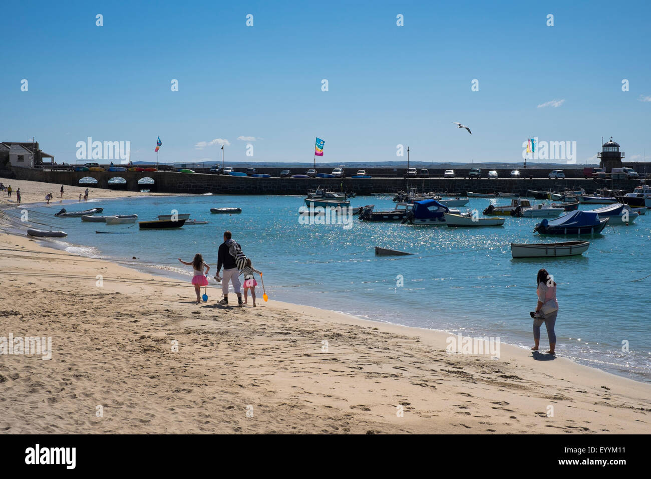 Family sunbathing beach hi-res stock photography and images - Alamy