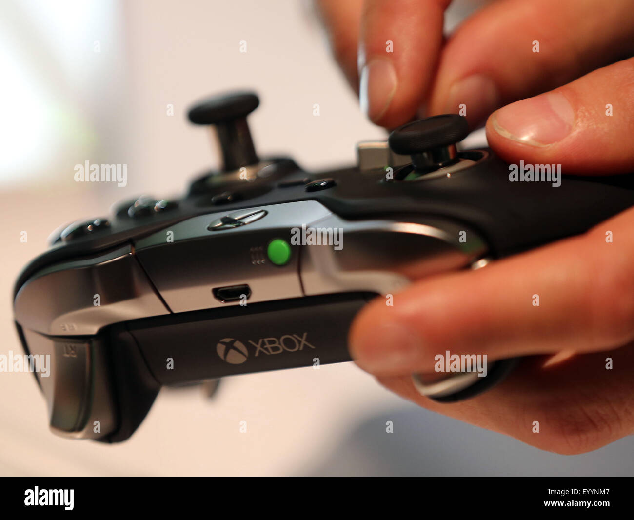 Cologne, Germany. 05th Aug, 2015. Visitors try out Microsoft's games ...