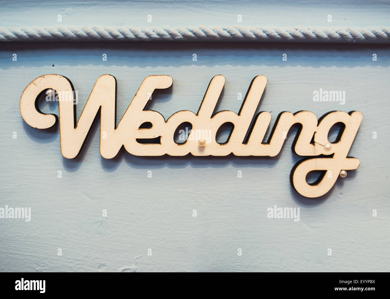 Word "wedding" on wooden background Stock Photo - Alamy