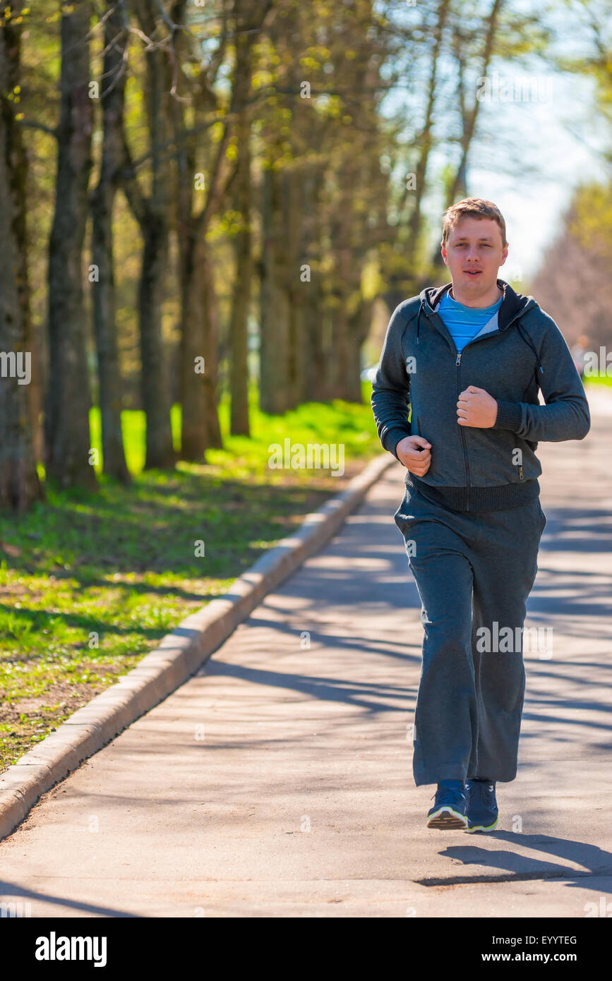 happy cheerful man running in the morning in the park Stock Photo - Alamy