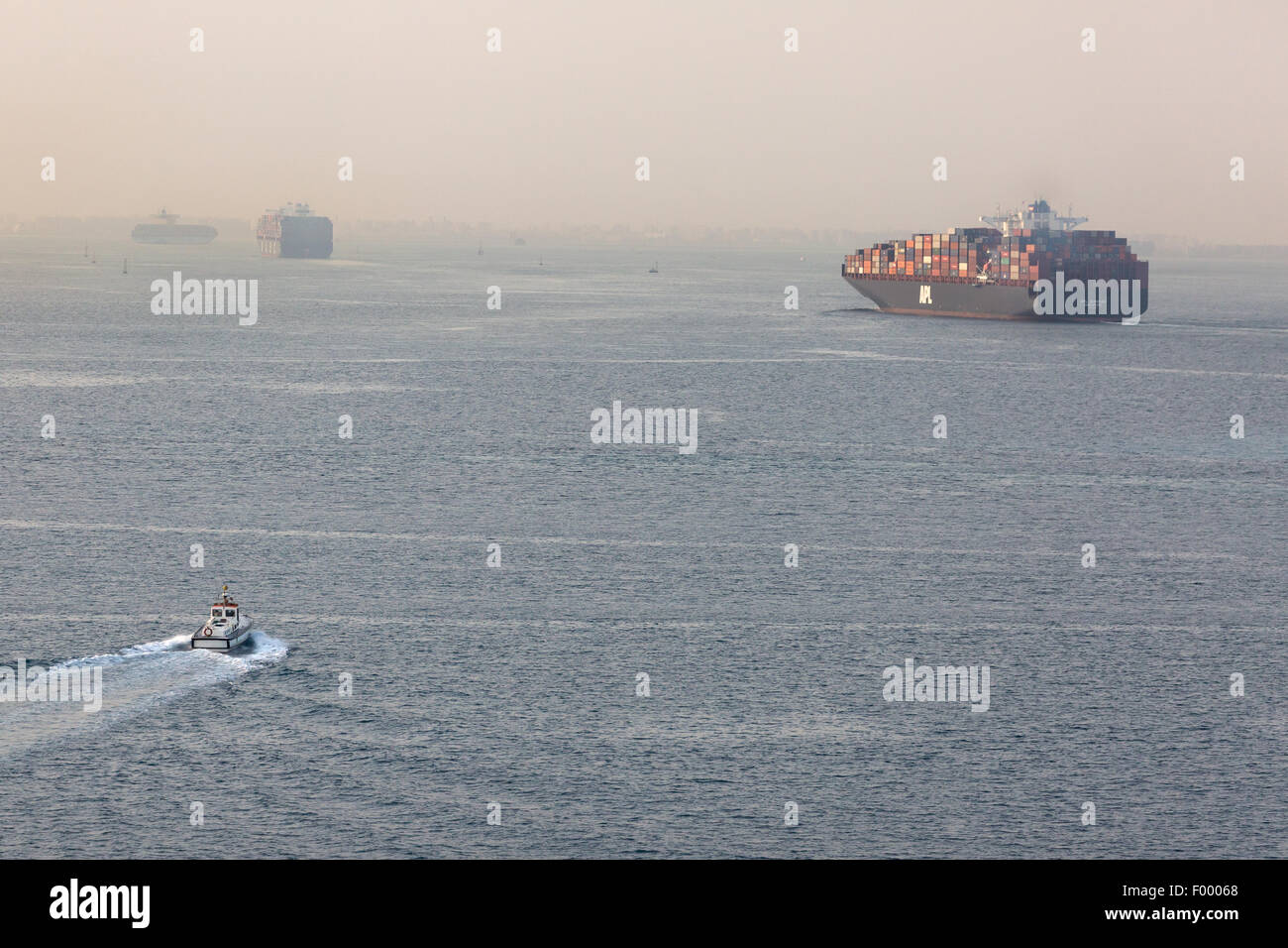 Suez canal Pilot launch Egypt, heading for convoy ships in mist. Suez ...
