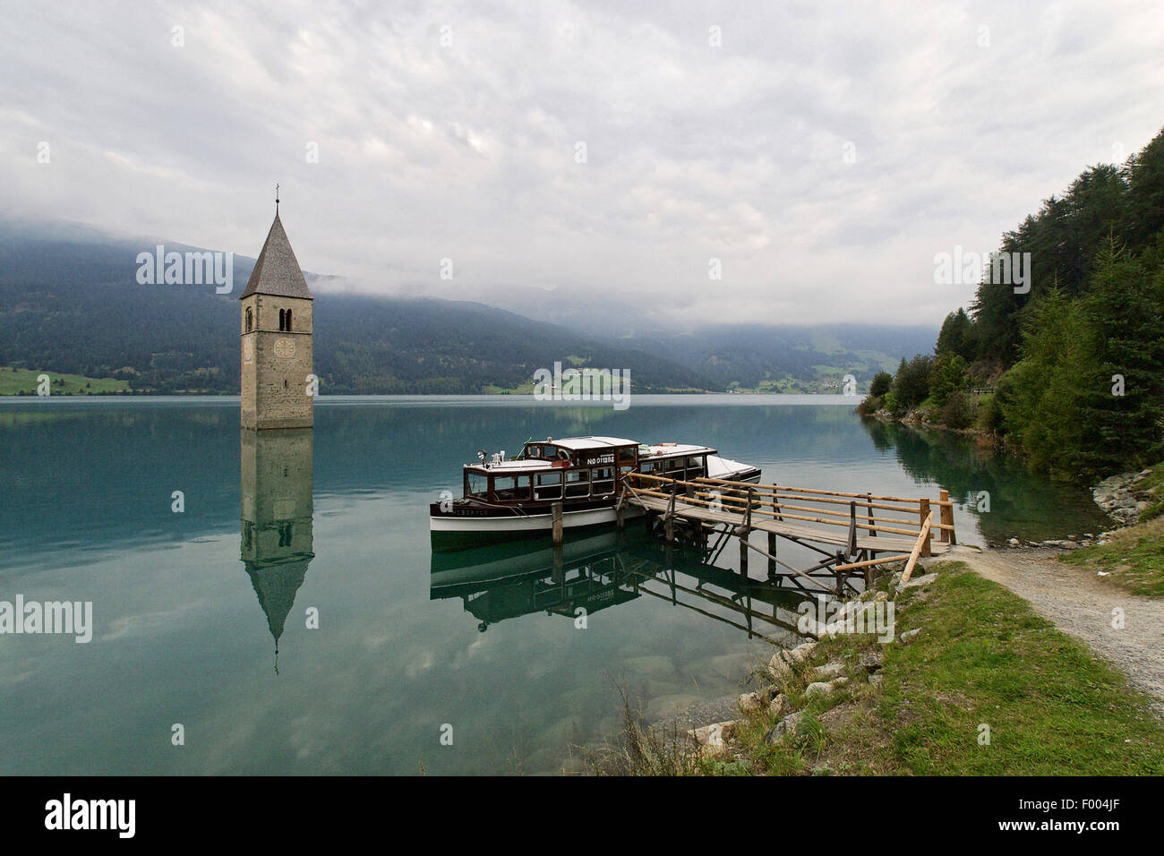 steeple of the church of Alt-Graun in Lake Reschen, Italy, South Tyrol ...