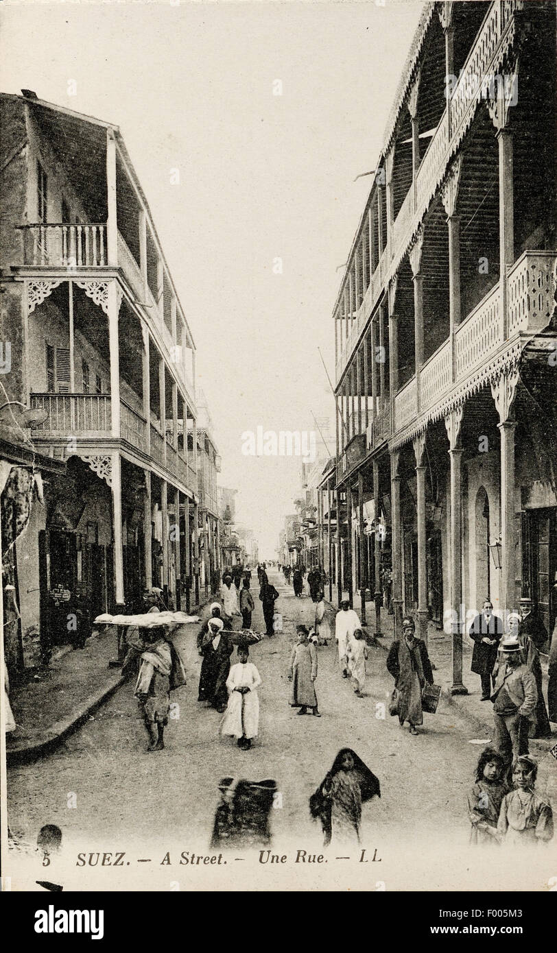 Suez, Egypt - 1900 - An old postcard of a bustling street in Suez, the ...